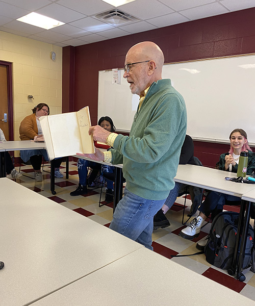 Creative Writing alum shares rare poetry collection with students
